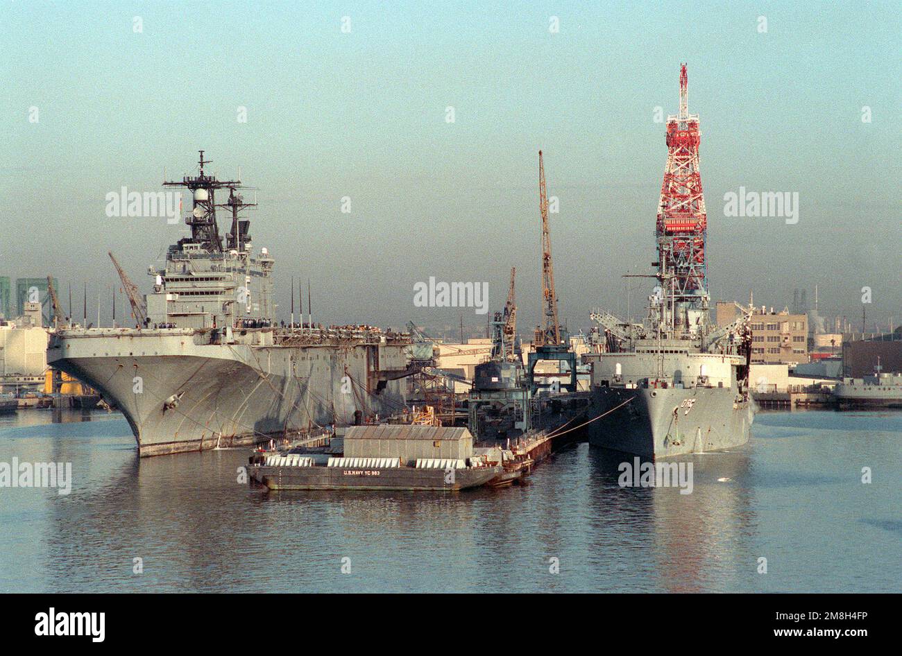 A view of the amphibious ship USS PELILEU (LHA-5) and the replenishment ...