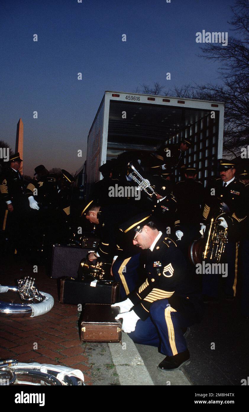 Members of the U.S. Army Field Band break down their instruments in the ...