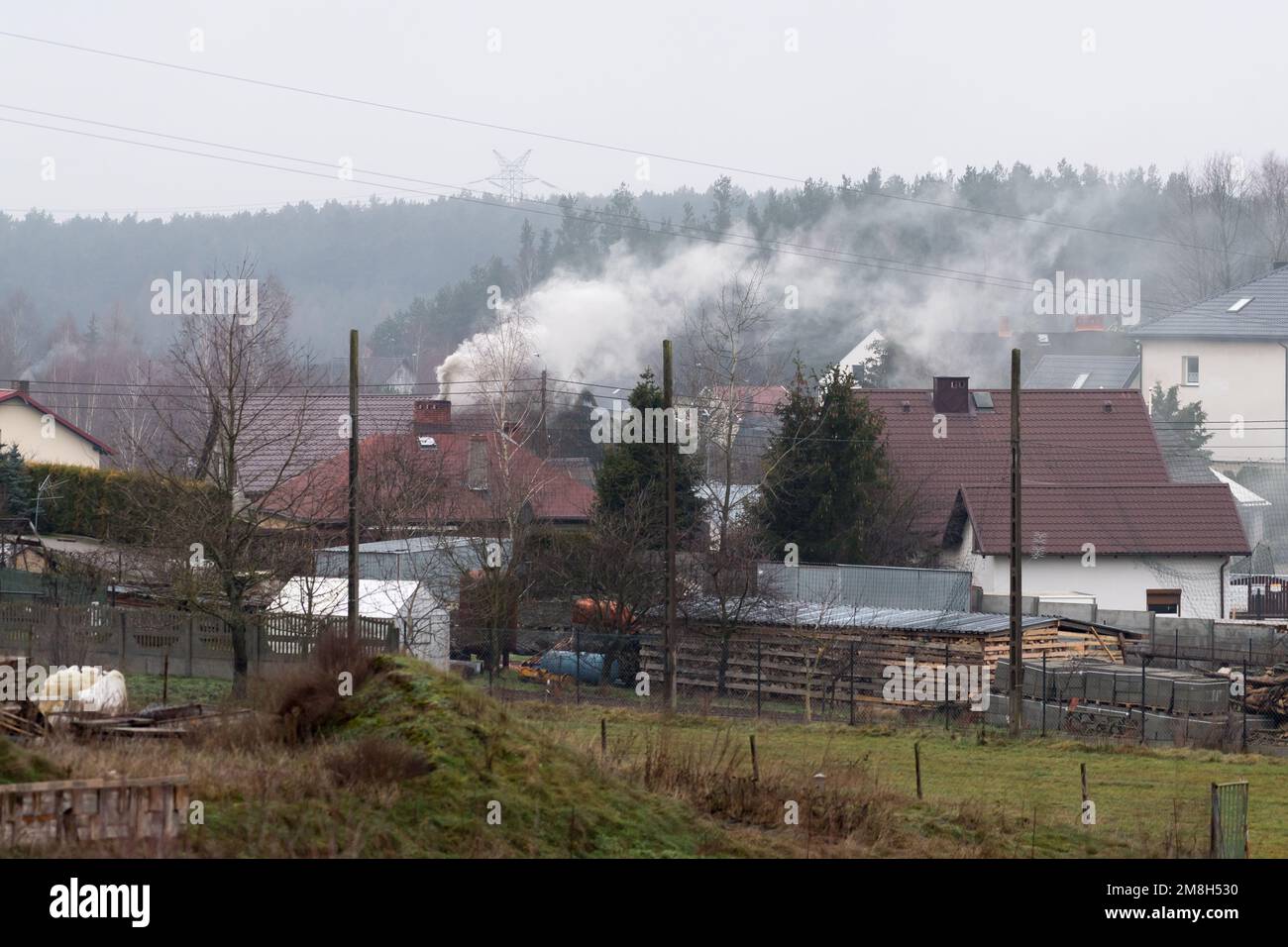 Winter air pollution by smoking chimney in Robakowo, Poland © Wojciech ...