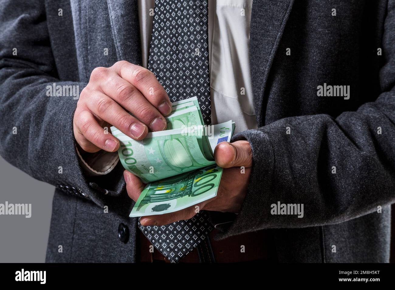 Rich man euros hi-res stock photography and images - Alamy