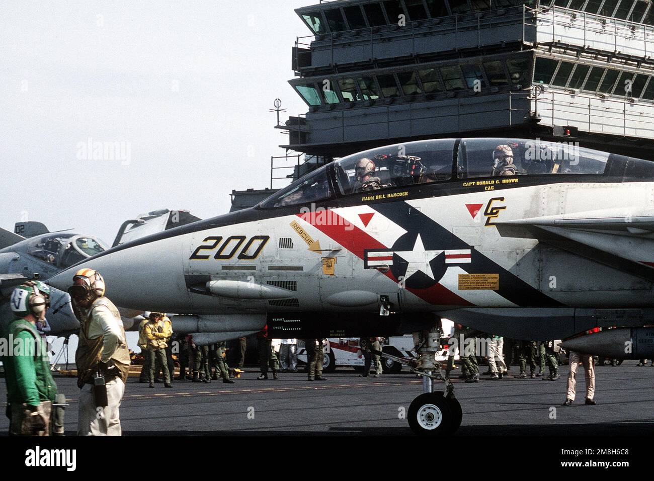 A Fighter Squadron 2 (VF-2) F-14A Tomcat aircraft taxis on the flight ...