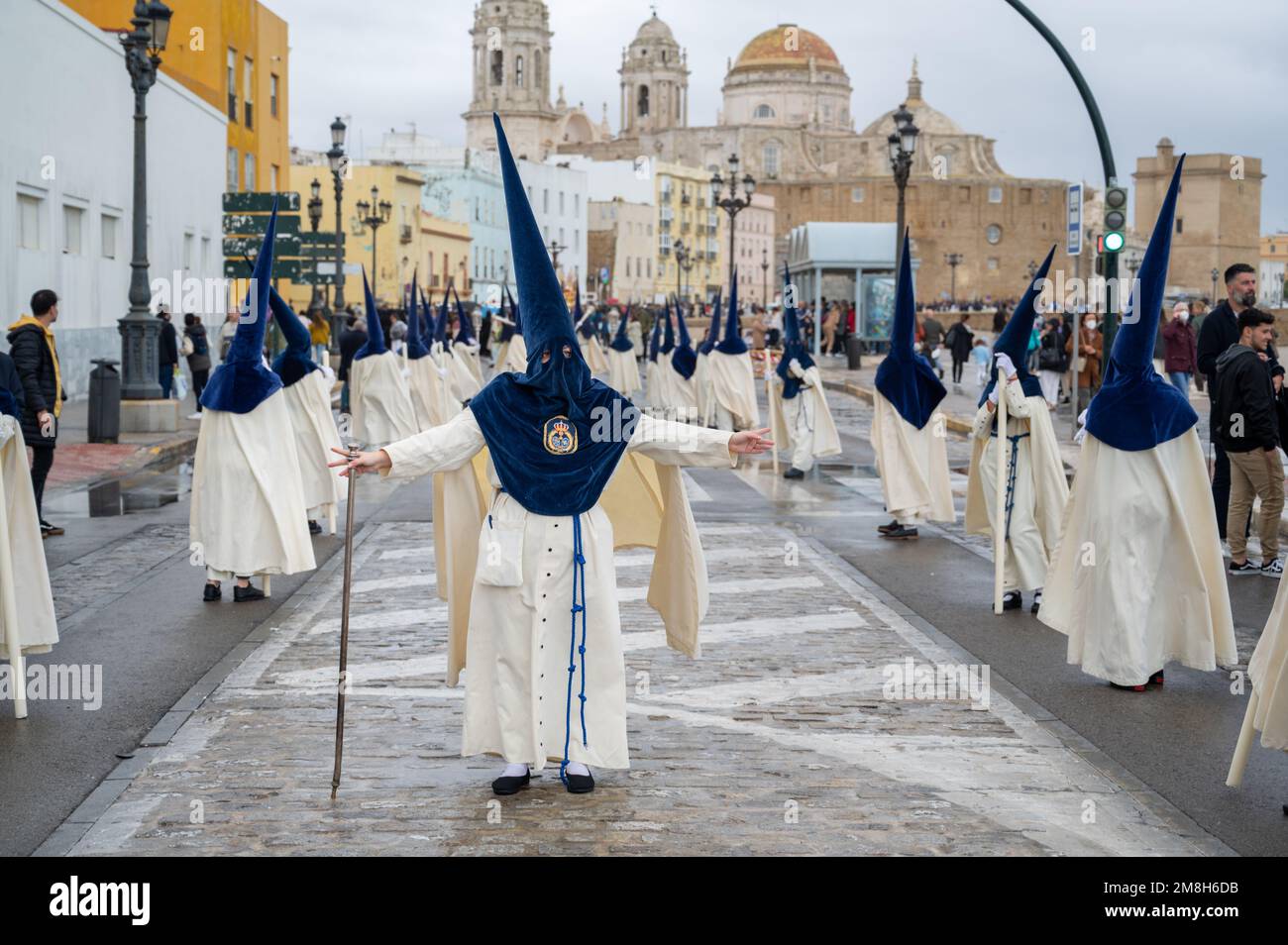 People in traditional dress weraing a capriote, or pointed hat in an ...