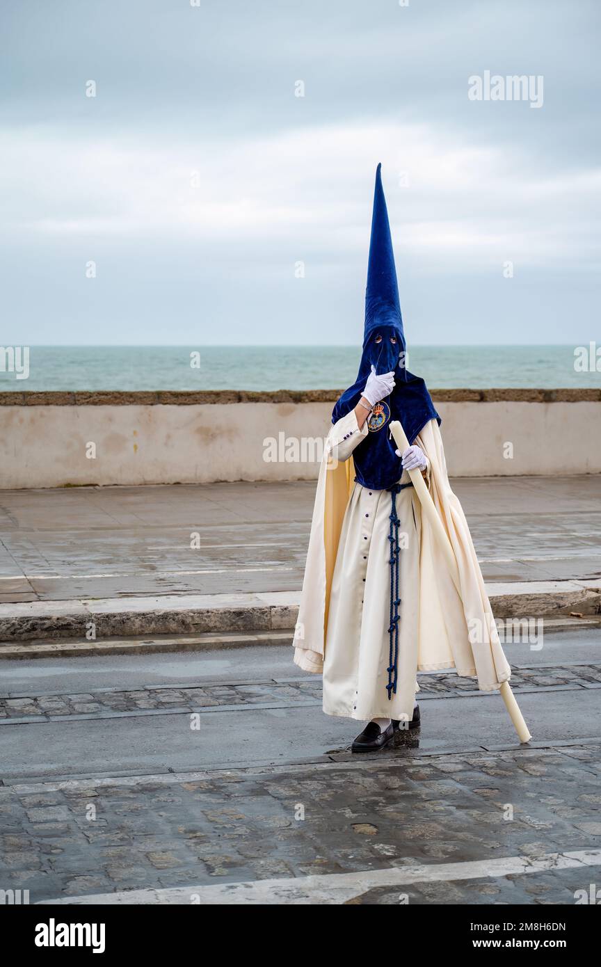 People in traditional dress weraing a capriote, or pointed hat in an ...