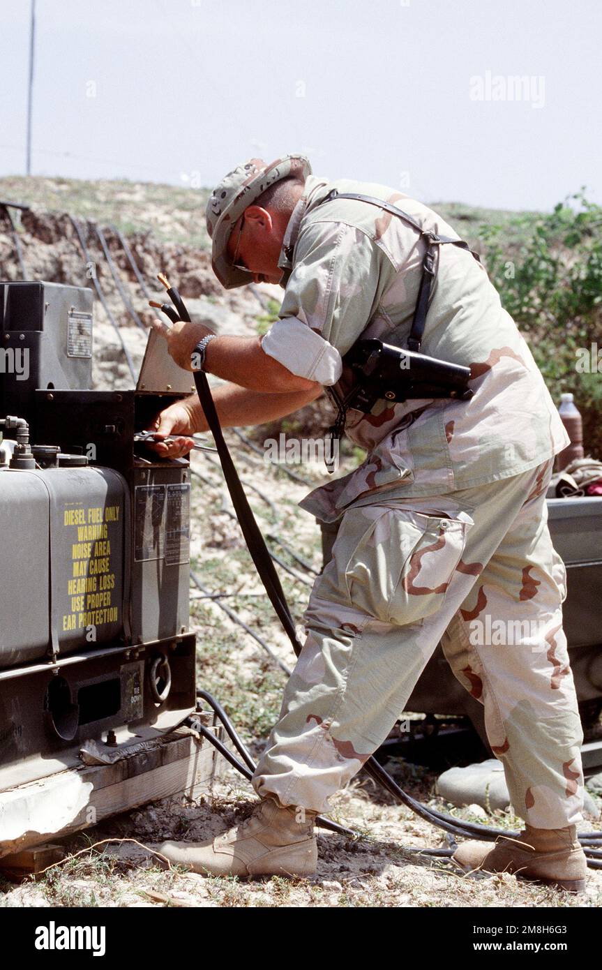 CHIEF Construction Electrician John W. Hibdon wires a generator at Camp ...