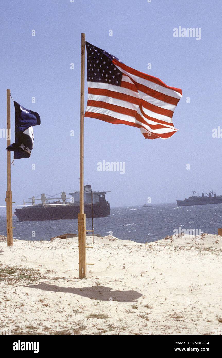 A stiff ocean breeze keeps the colors flying at Camp Stalder, the ...