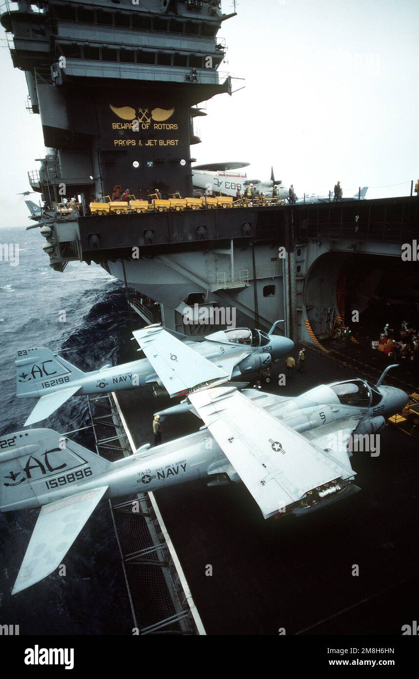 Two Attack Squadron 75 (VA-75) A-6E Intruder aircraft are secured on an ...