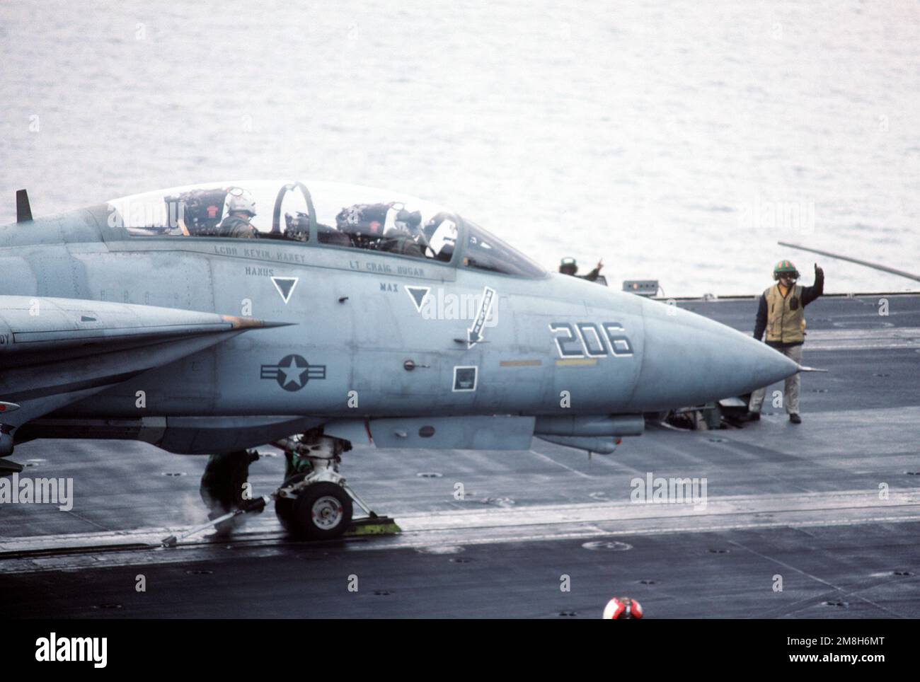 A catapult crew on the aircraft carrier USS JOHN F. KENNEDY (CV-67 ...