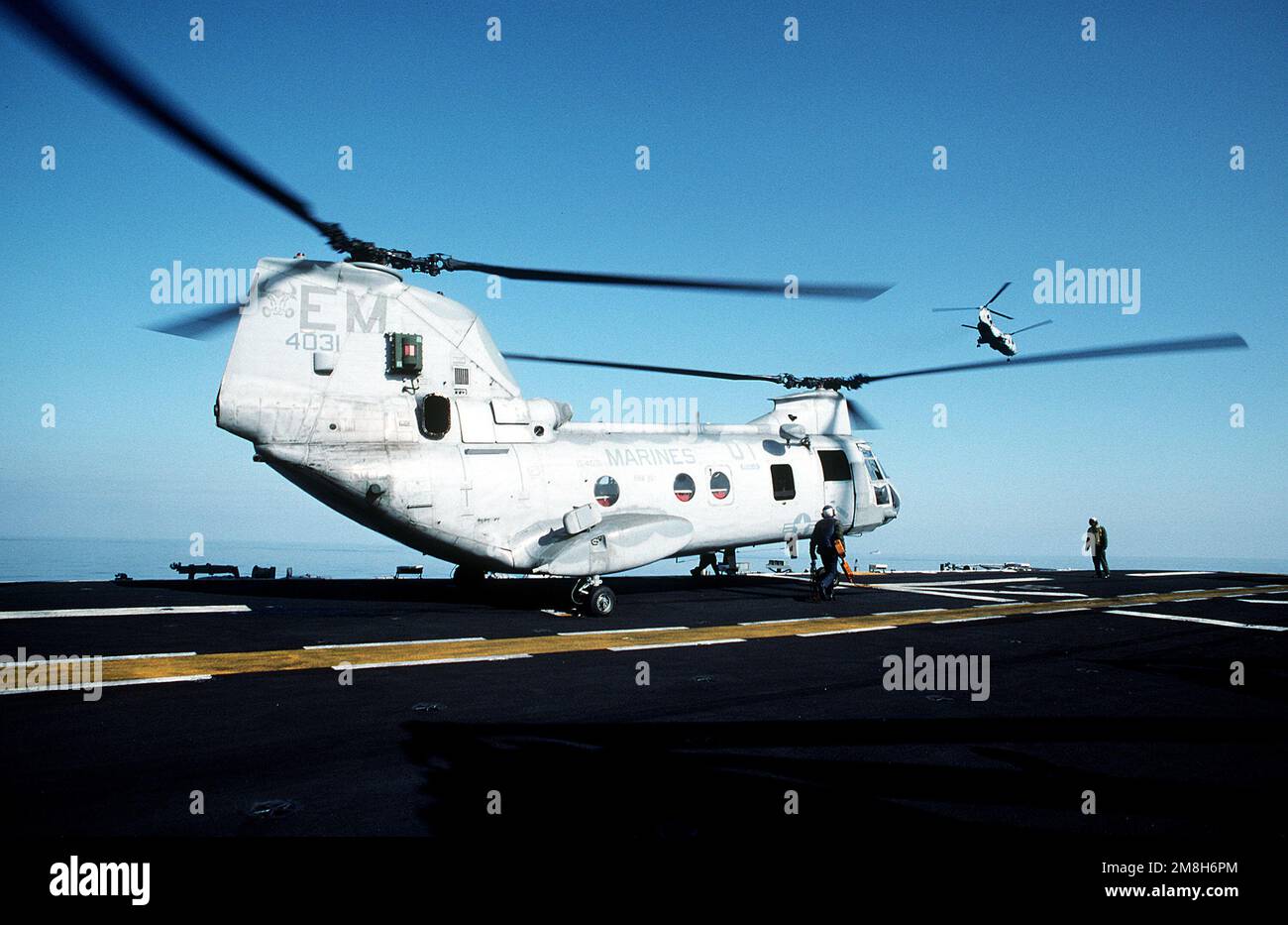 Flight deck crewmen prepare a Marine Medium Helicopter Squadron 261 ...