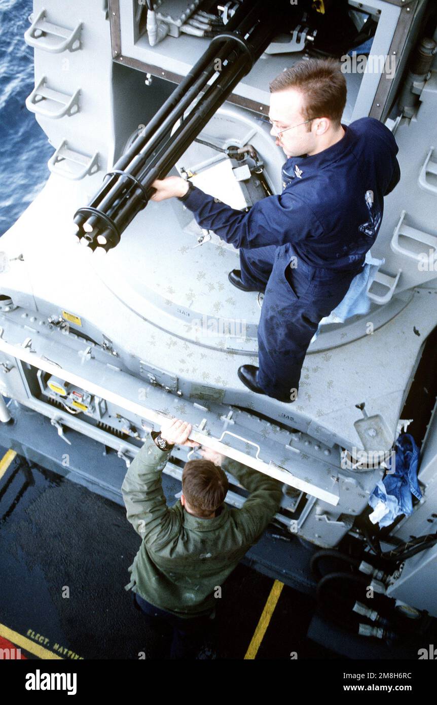 A fire control technician performs preventive maintenance on one of the ...