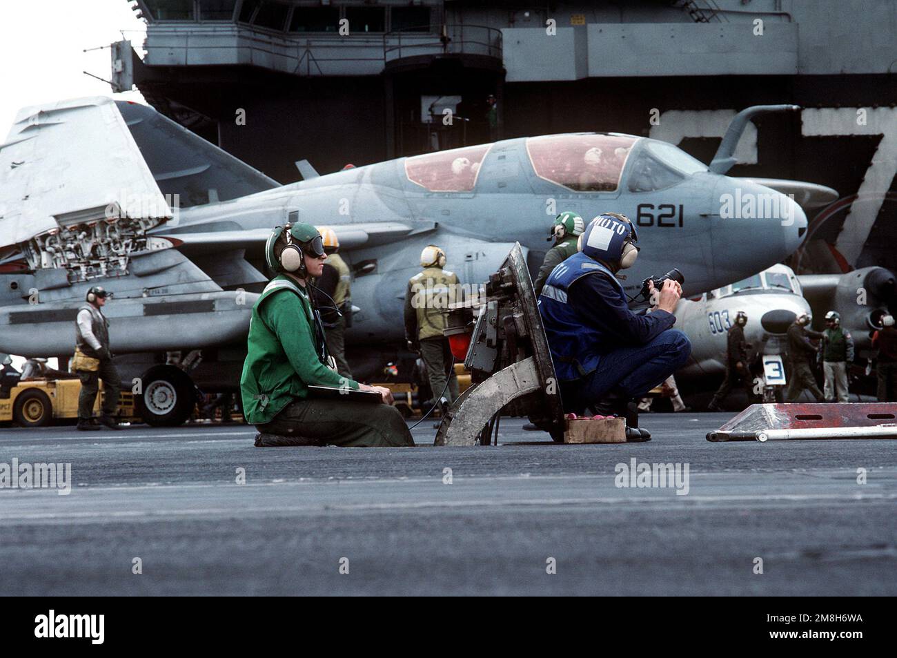 The catapult console operator and a photographer wait for another ...