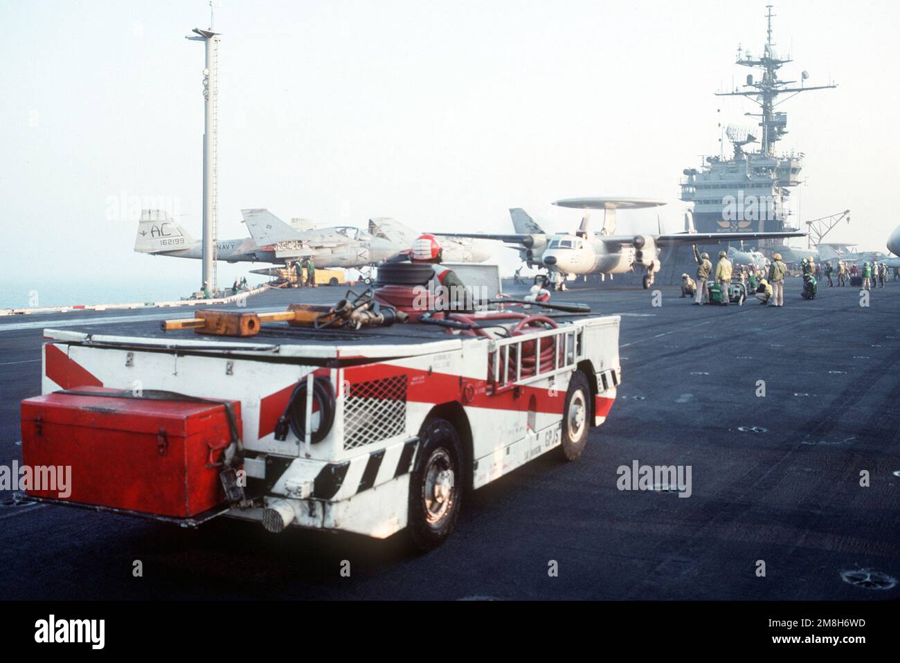 A member of the crash, salvage and rescue team mans a P-16 shipboard ...