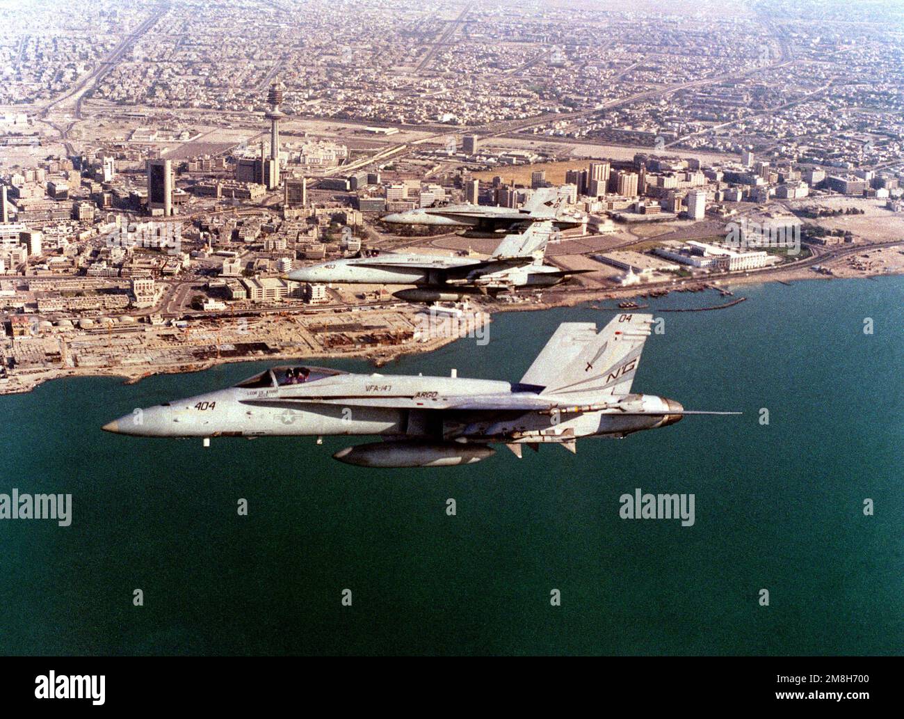 Three F/A-18C Hornets from the aircraft carrier USS NIMITZ (CVN-68) fly ...