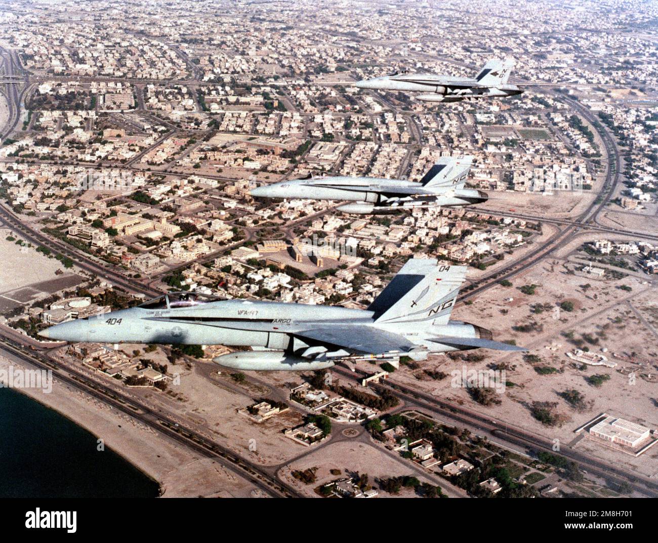 Three F/A-18C Hornets from the aircraft carrier USS NIMITZ (CVN-68) fly ...