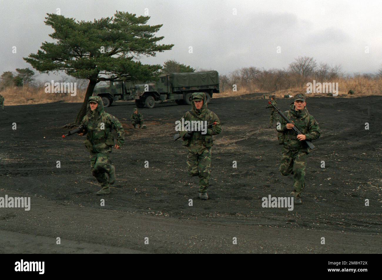 Three Marines of Combat Service Support Detachment 36 (CSSD-36) run ...