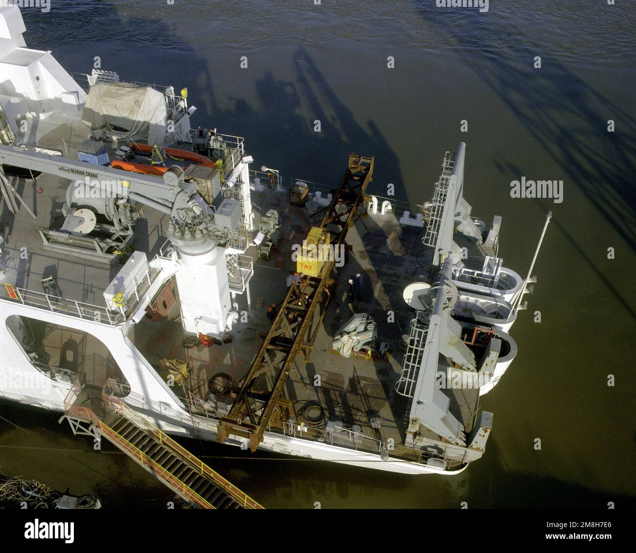 An overhead view of the stern section of the surveying ship USNS WATERS ...