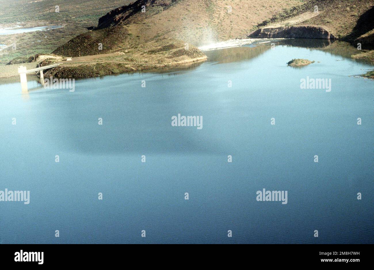 An aerial view of Painted Rock Dam and the surrounding flooded area ...