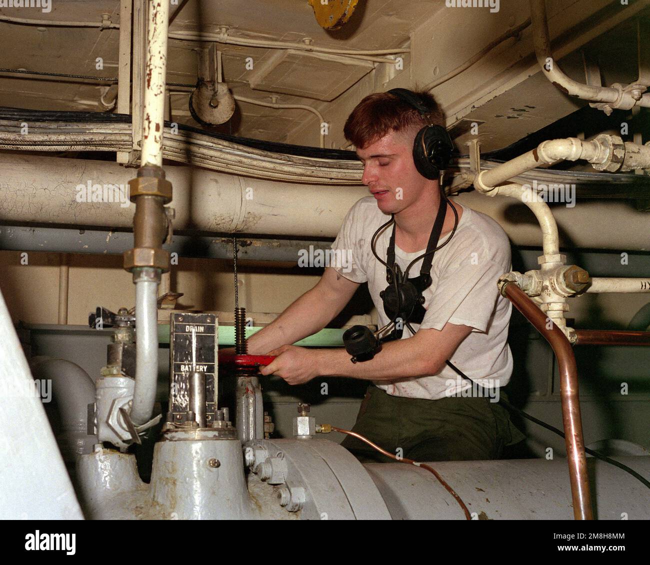 A seaman aboard the nuclear-powered aircraft carrier USS NIMITZ (CVN-68 ...