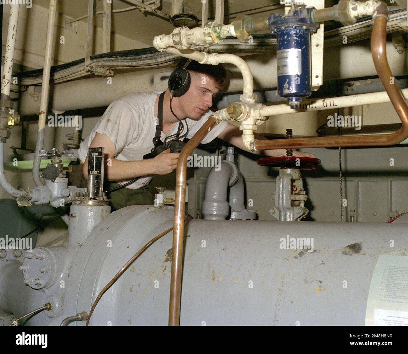 A seaman aboard the nuclear-powered aircraft carrier USS NIMITZ (CVN-68 ...