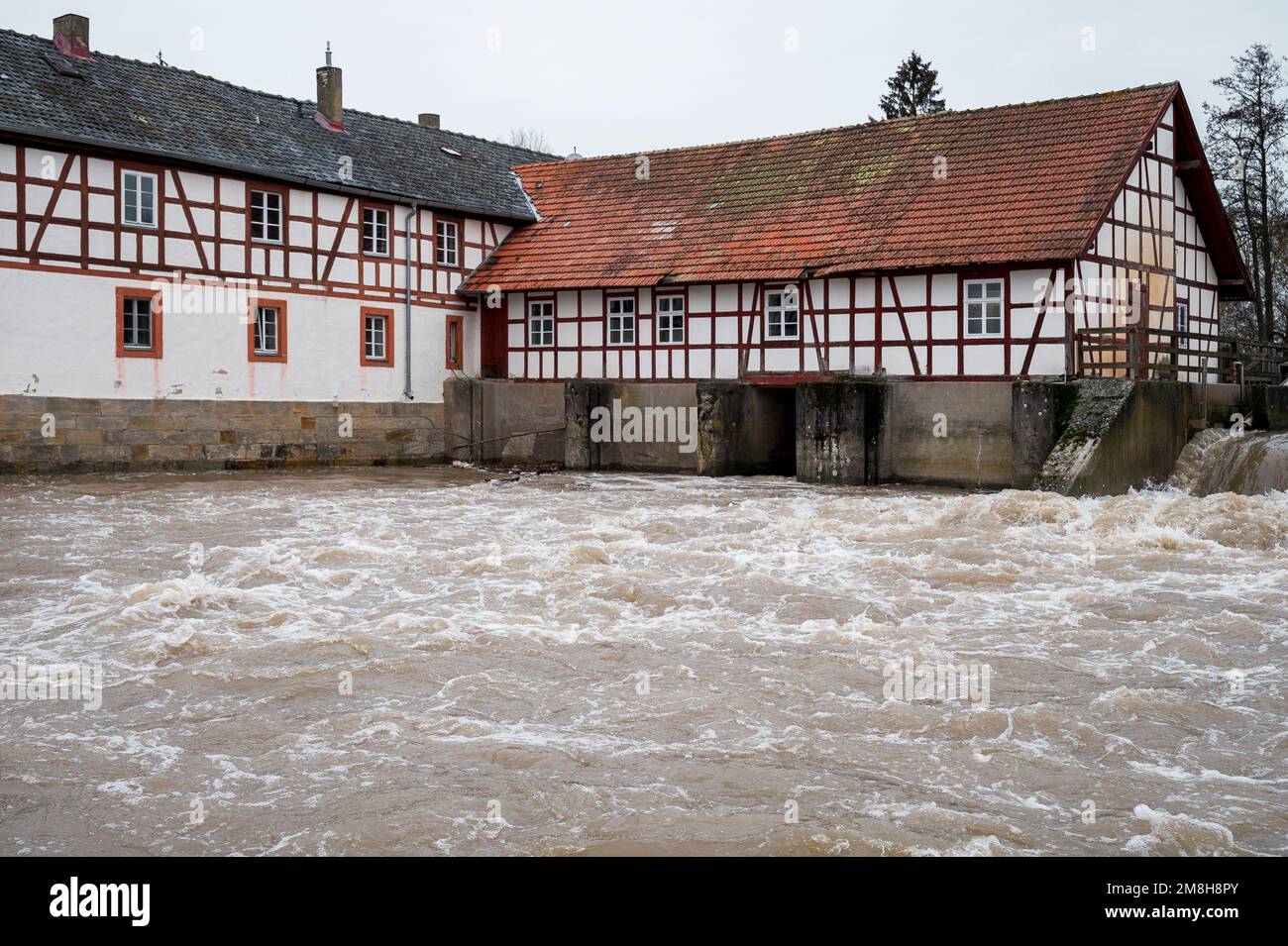 Itzgrund, Germany. 14th Jan, 2023. Water flows at the hydroelectric ...