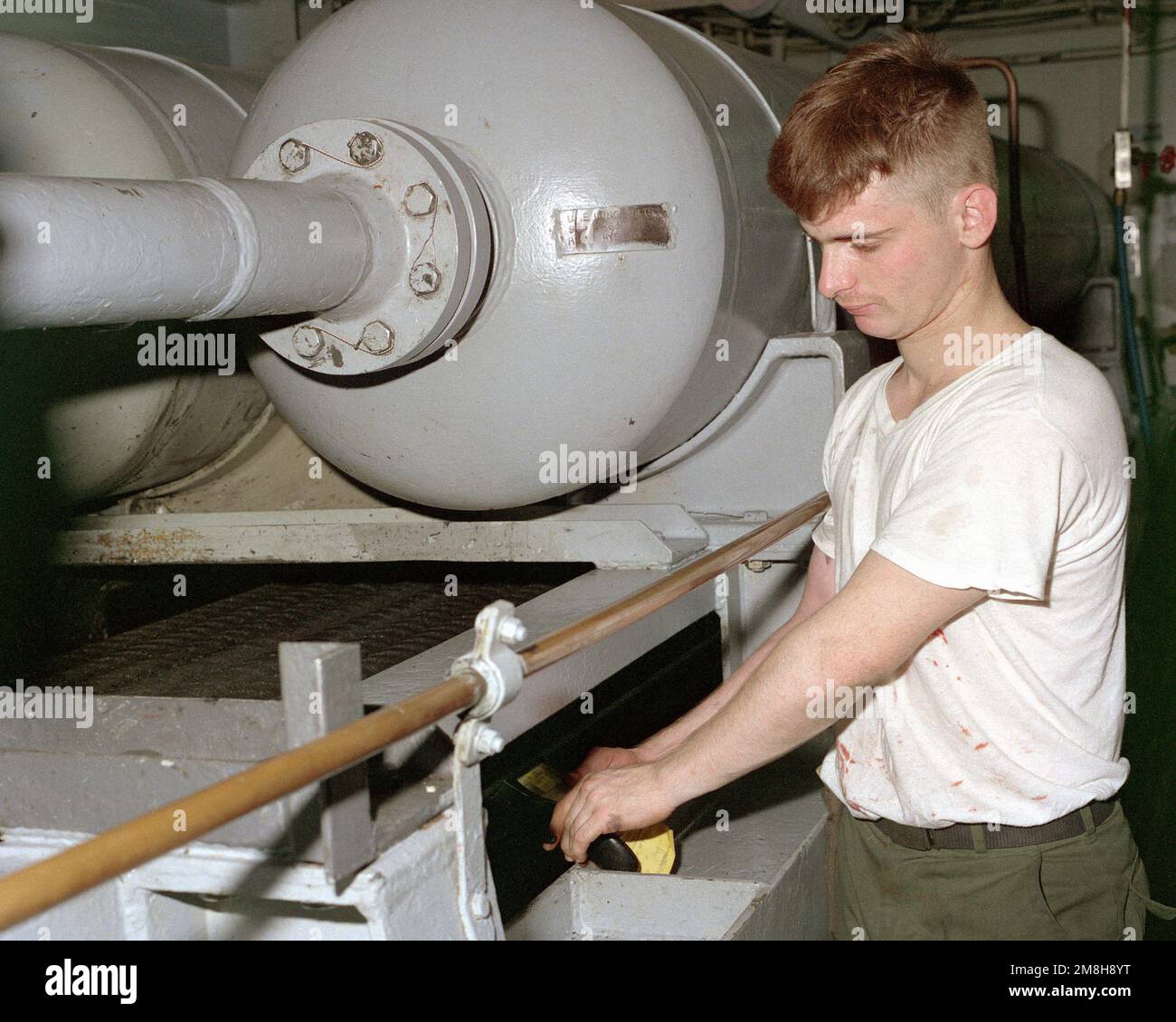 A seaman aboard the nuclear-powered aircraft carrier USS NIMITZ (CVN-68 ...