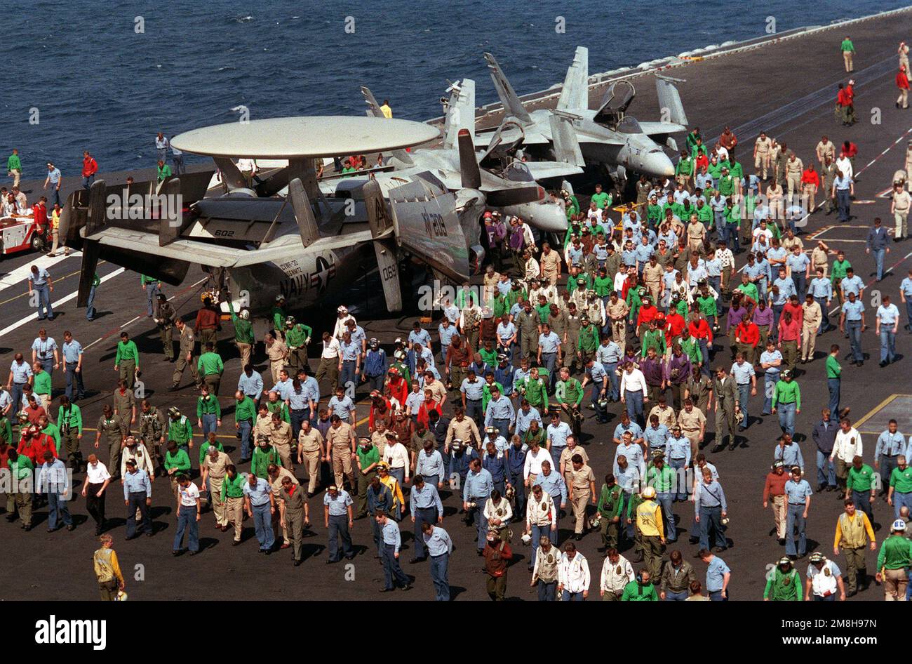 Crew members conduct a foreign object damage (FOD) walk-down on the ...