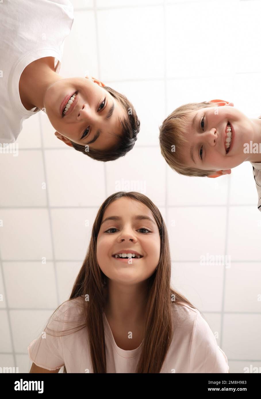 Happy little friends at home, bottom view Stock Photo - Alamy