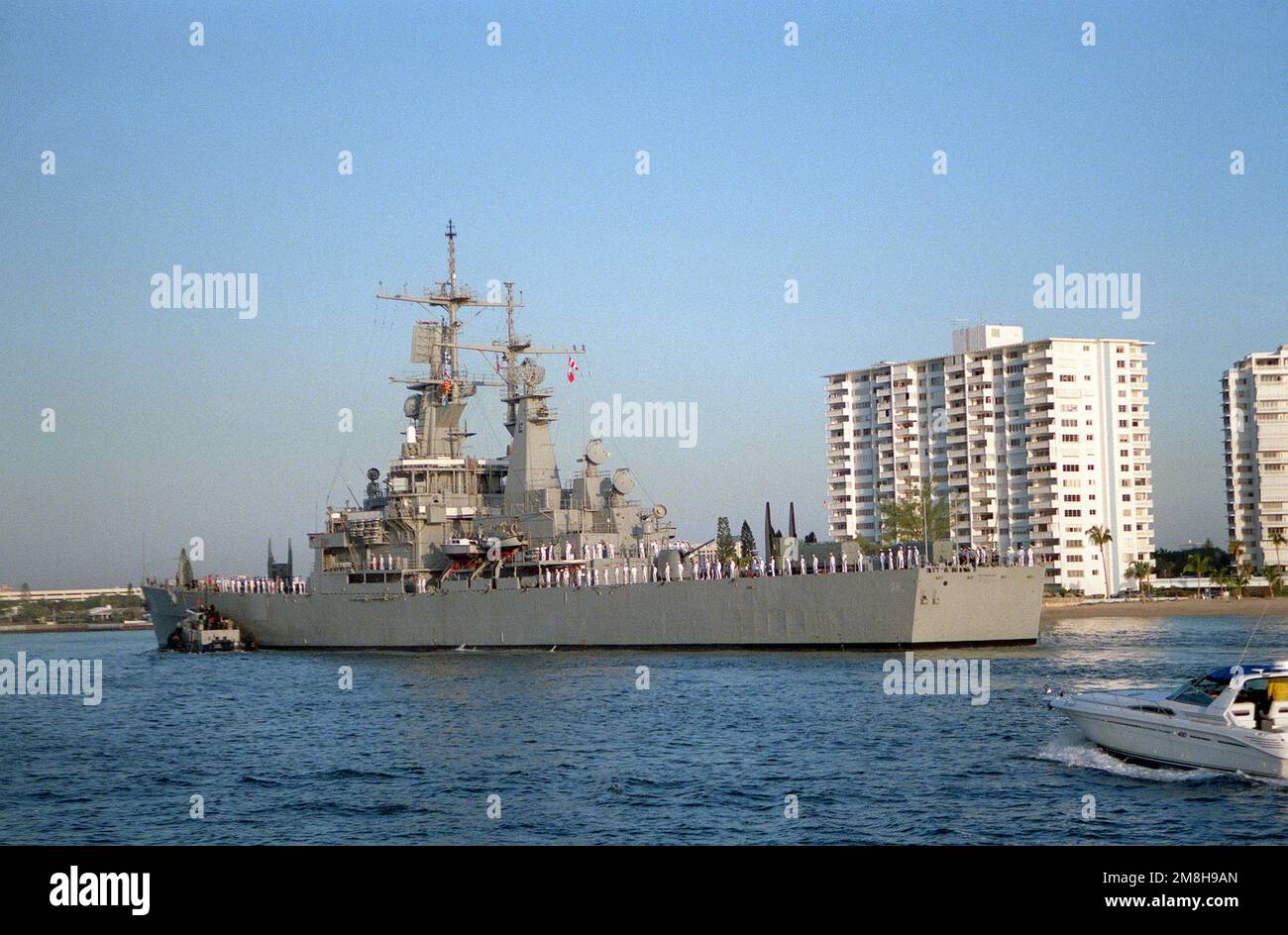 Crewmen man the rails of the nuclear-powered guided missile cruiser USS ...