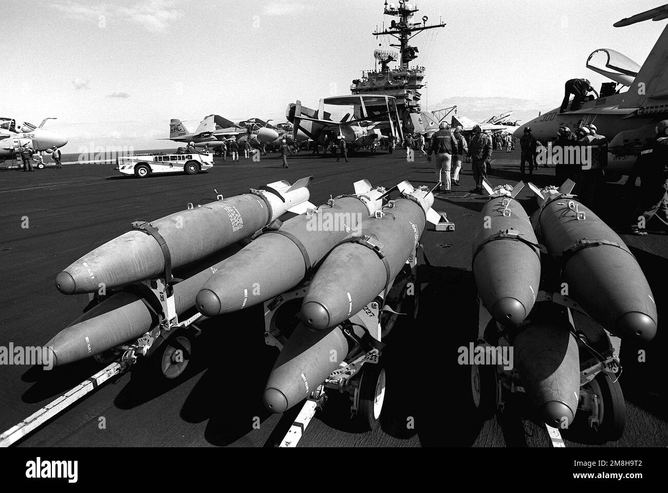 Weapons skids loaded with 500-pound practice bombs sit on the flight ...