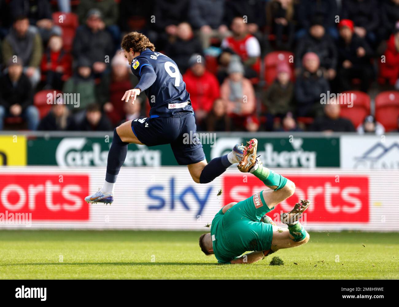 Blackburn Rovers' Sam Gallagher leaps over Rotherham United goalkeeper ...