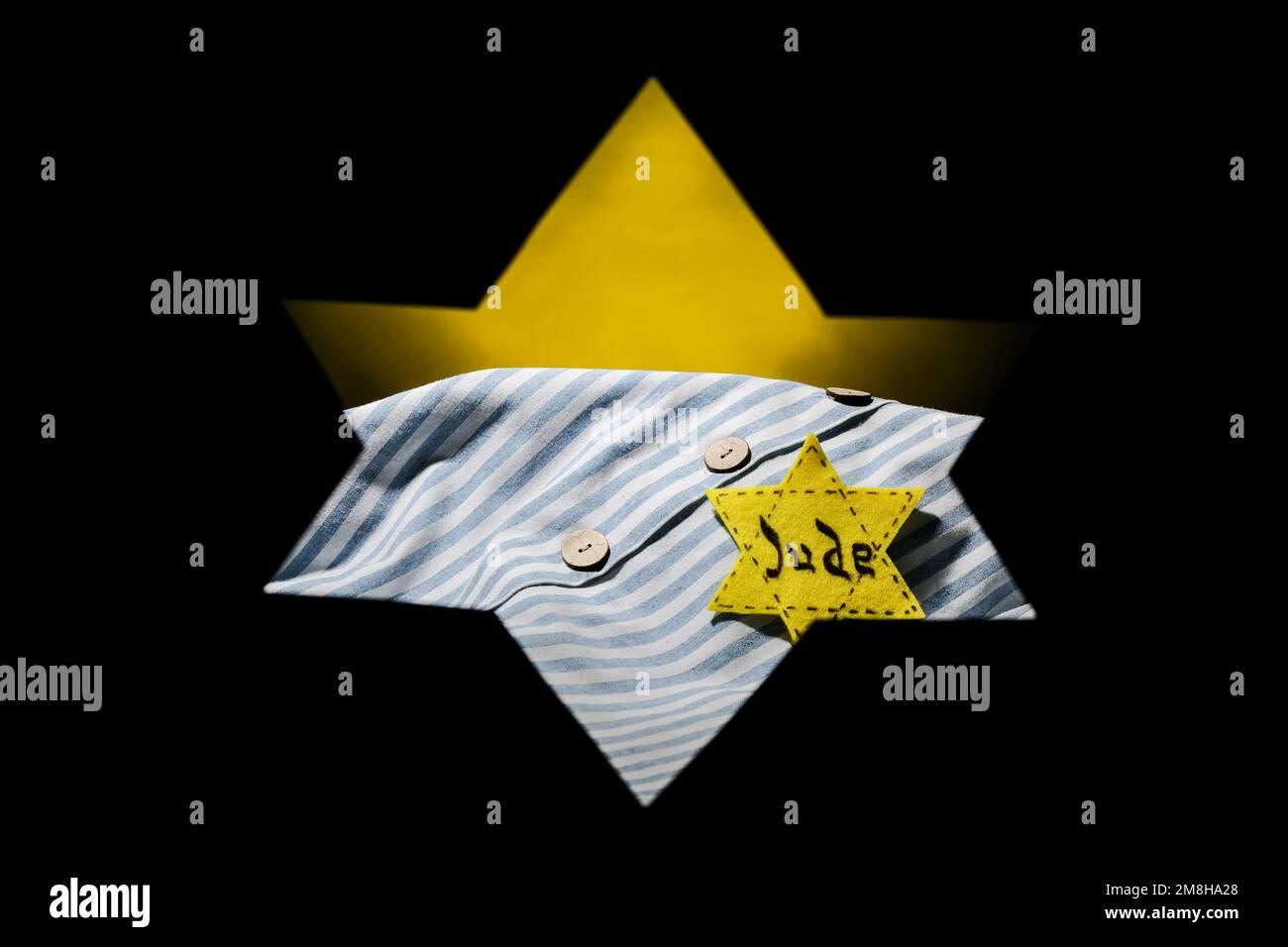 Prisoner uniform and Jewish badge visible through shape of David star ...
