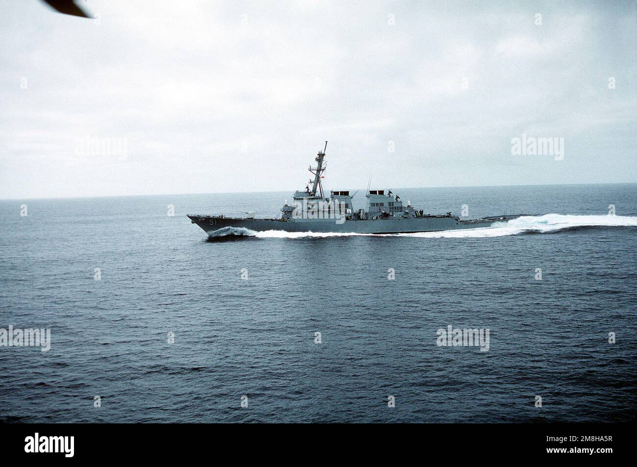 A port beam view of the guided missile destroyer USS ARLEIGH BURKE (DDG ...