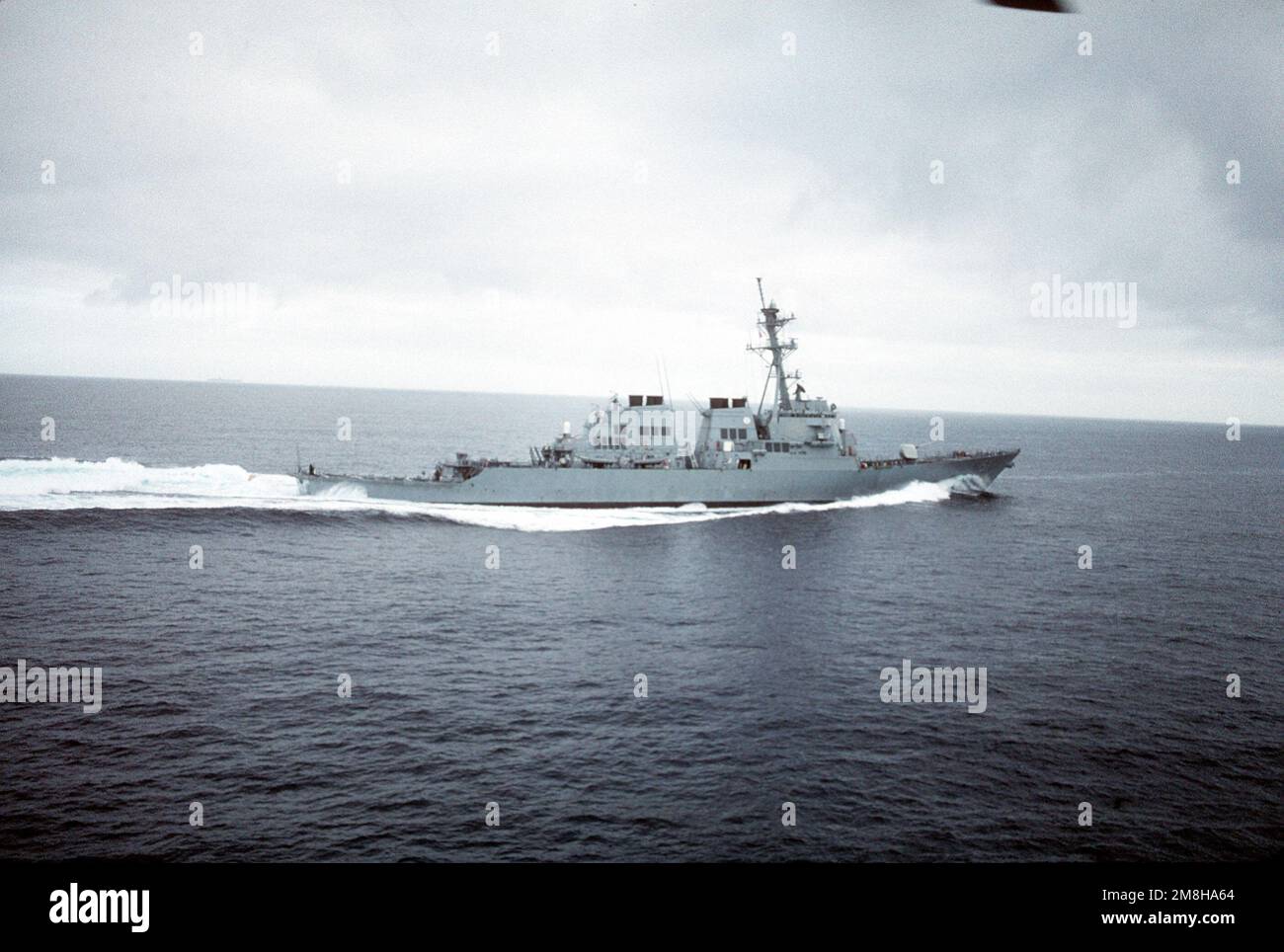 A starboard beam view of the guided missile destroyer USS ARLEIGH BURKE ...