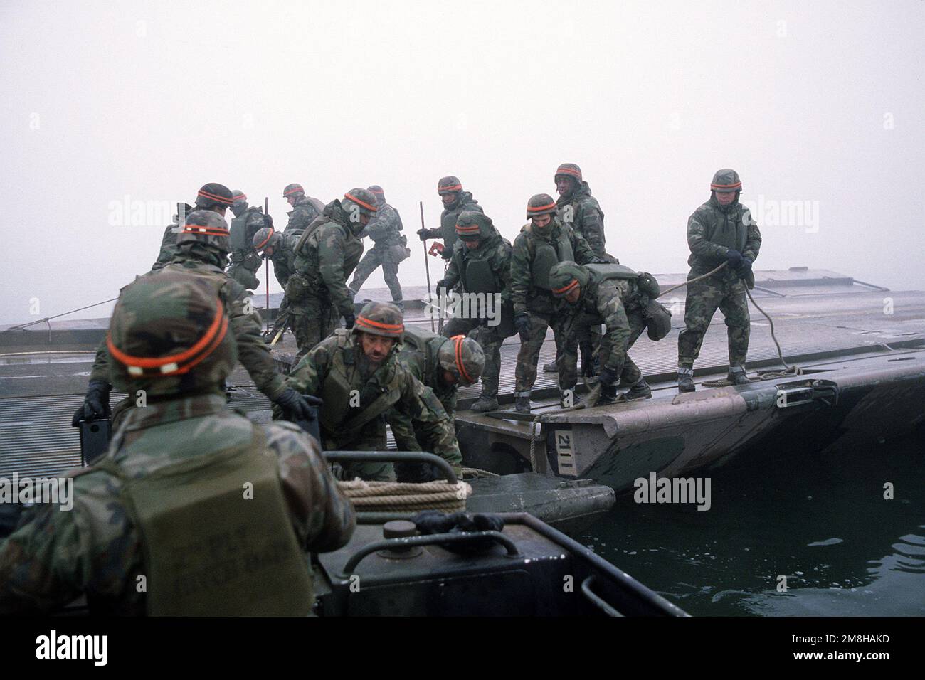 After maneuvering two floating bridge pontoon segments together and ...