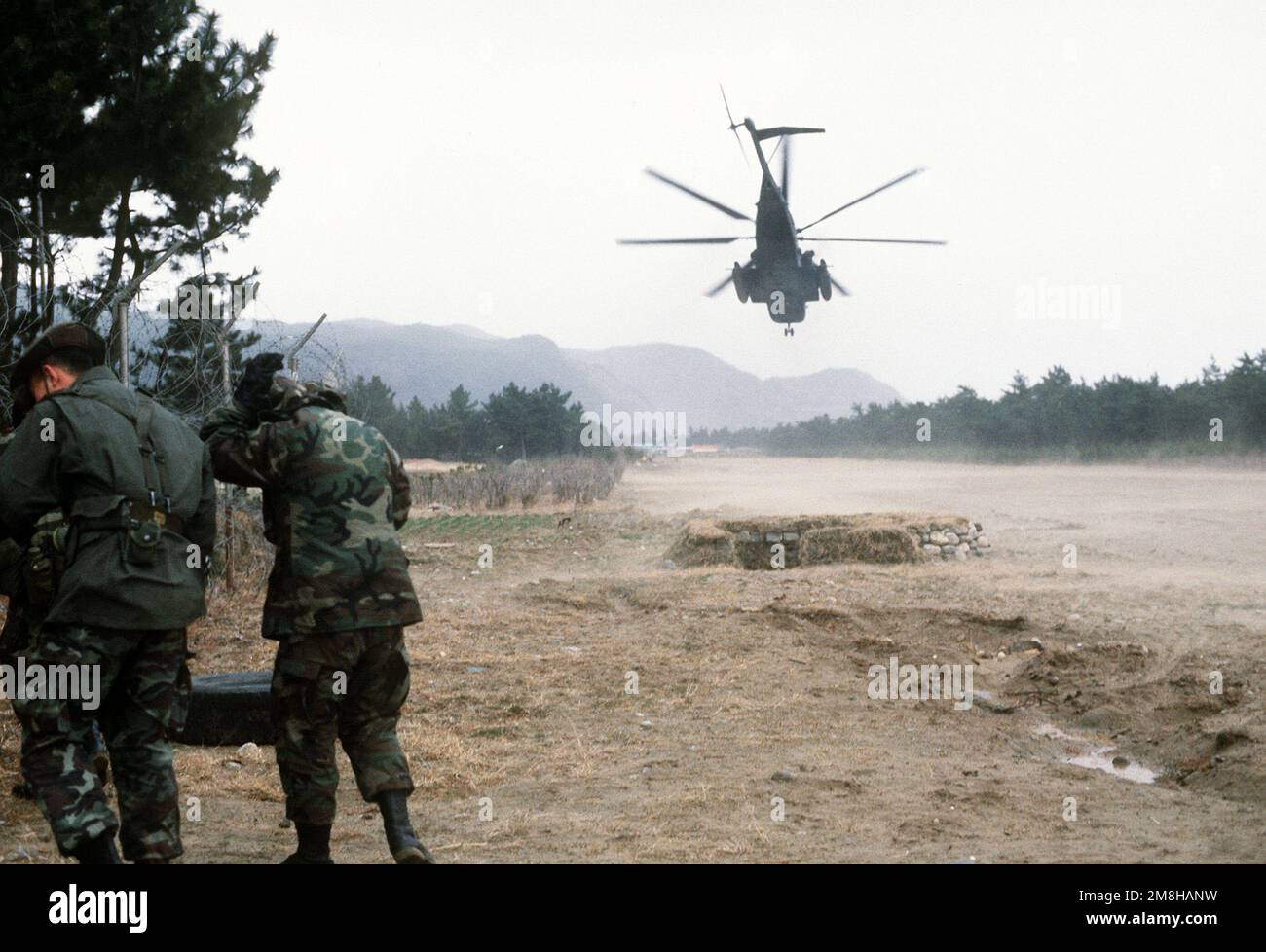 A U.S. Marine Corps CH-53E Super Stallion helicopter lifts off a runway ...