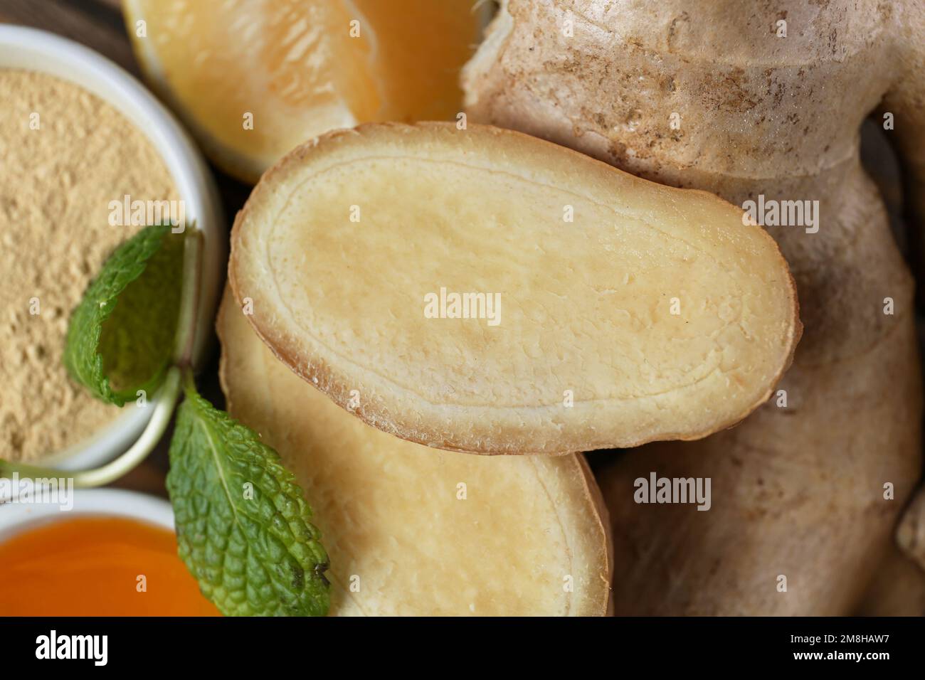 Fresh ginger slices as background Stock Photo - Alamy