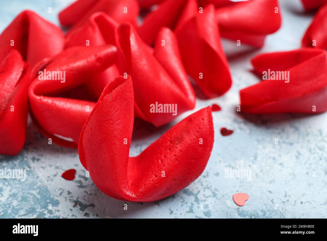 Red fortune cookies with hearts on grunge background, closeup ...