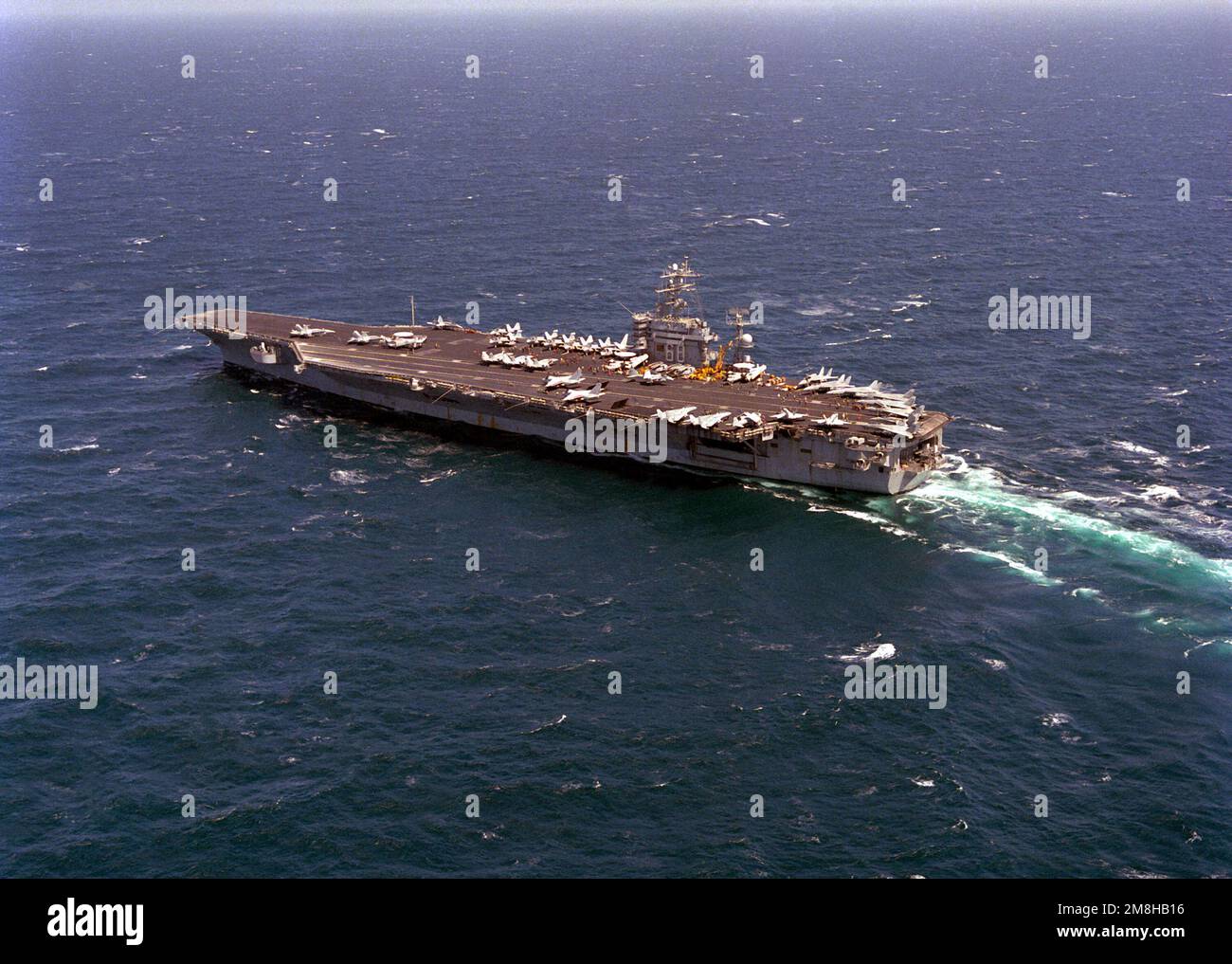 A port quarter view of the nuclear-powered aircraft carrier USS NIMITZ ...
