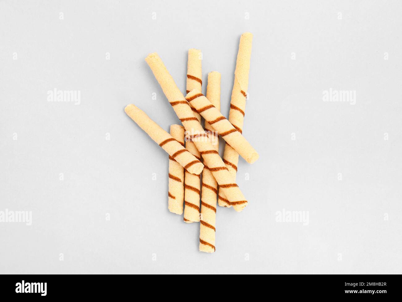 Tasty wafer rolls on grey background Stock Photo - Alamy