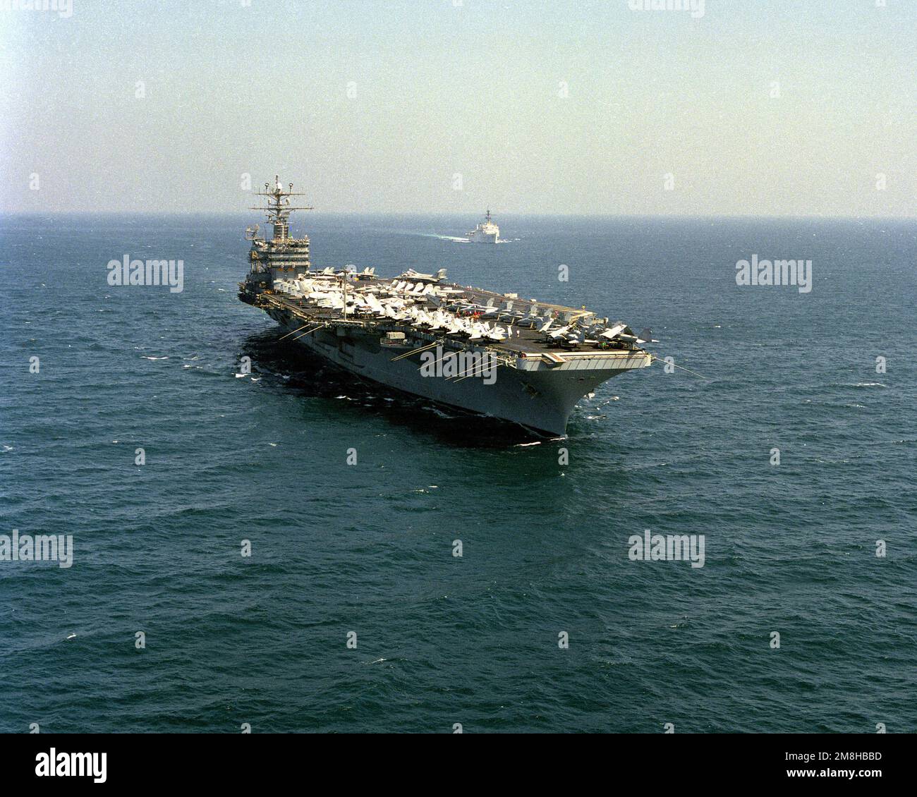 A starboard bow view of the nuclear-powered aircraft carrier USS NIMITZ ...