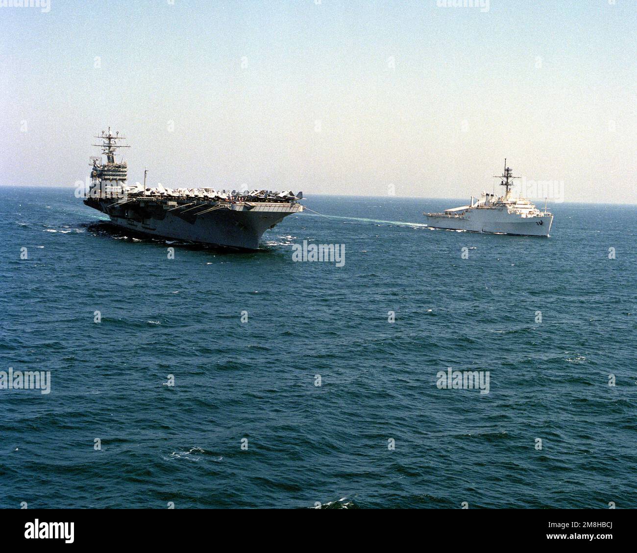 A starboard bow view of the nuclear-powered aircraft carrier USS NIMITZ ...