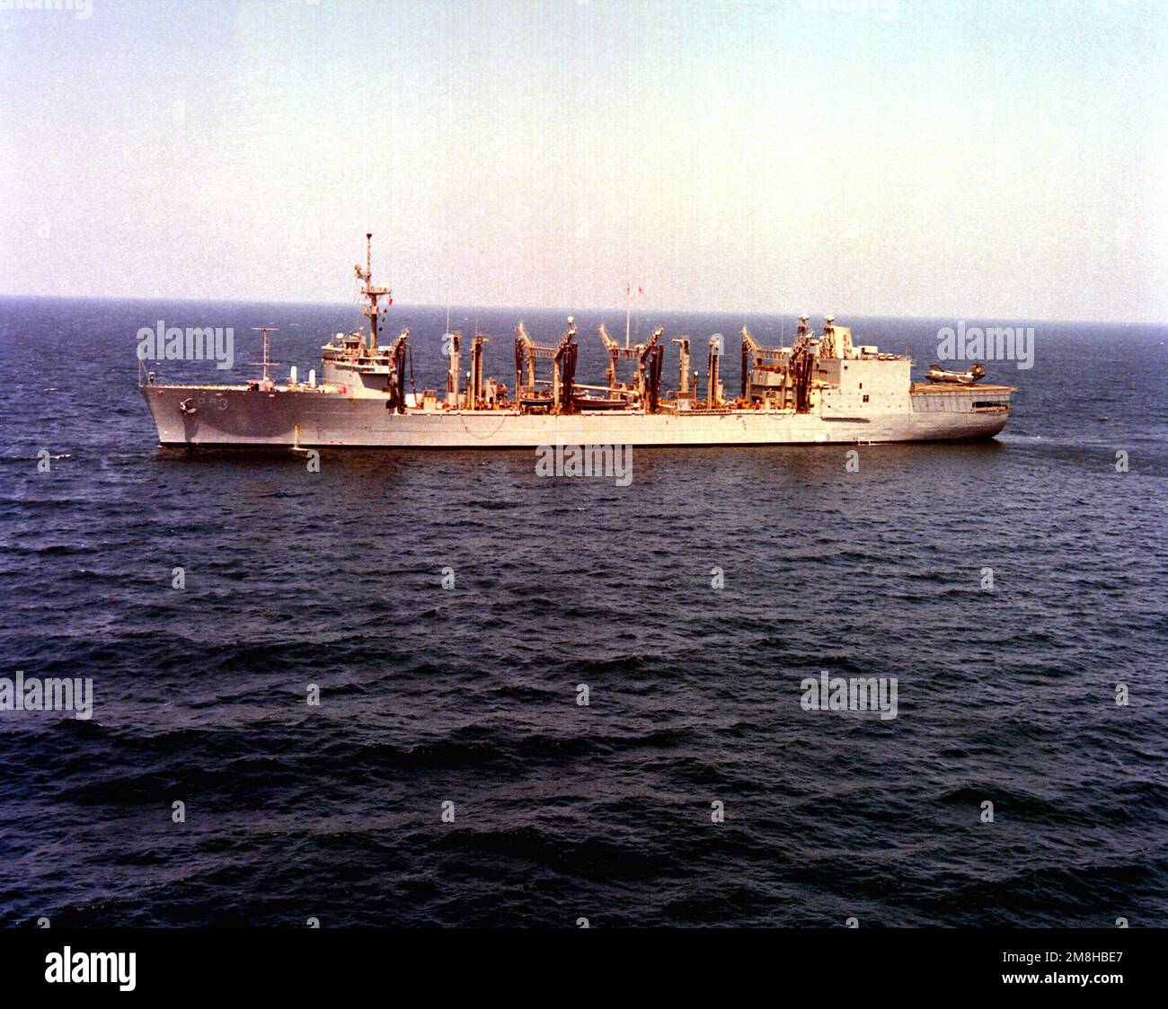 A port view of the fleet oiler USS KANSAS CITY (AOR-3) underway during ...