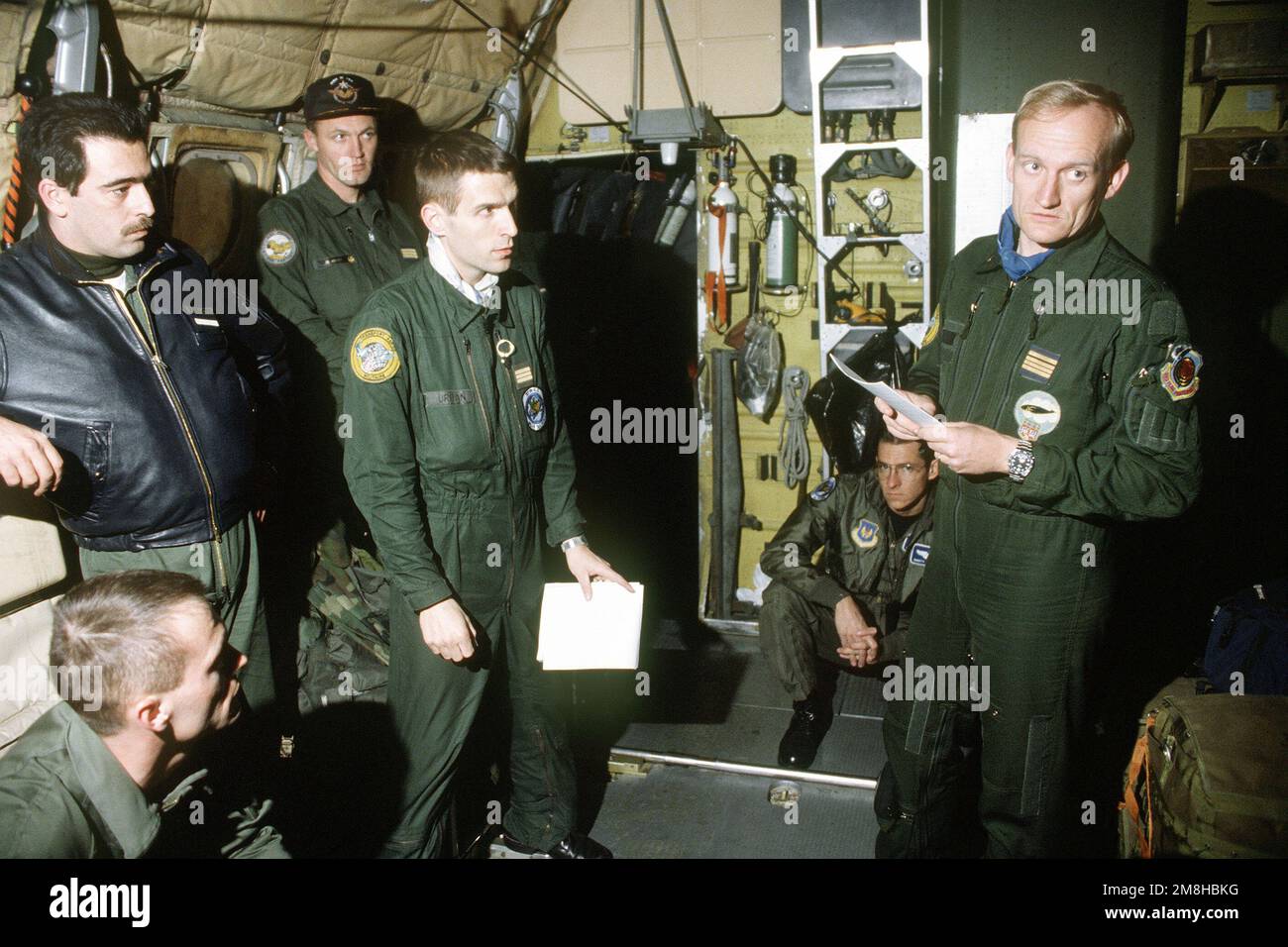 MAJ Maurin, a French Air Force C-160 Transall pilot, briefs his crew on ...