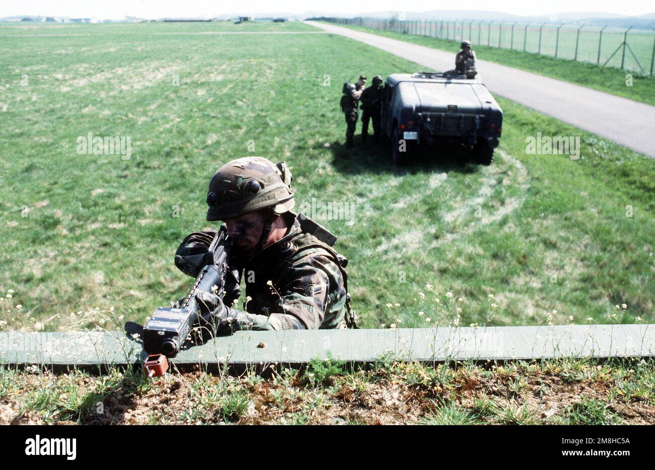 AIRMAN Jason Imboden from the 100th Security Police Squadron aims an M ...