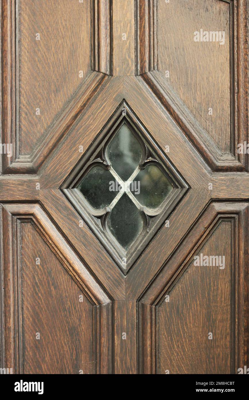 Vintage carved wood door with a diamond window Stock Photo - Alamy