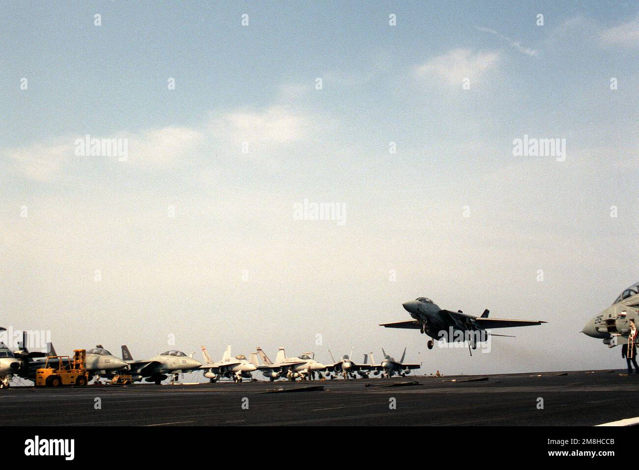 A Fighter Squadron 84 (VF-84) F-14A Tomcat aircraft lands on the ...