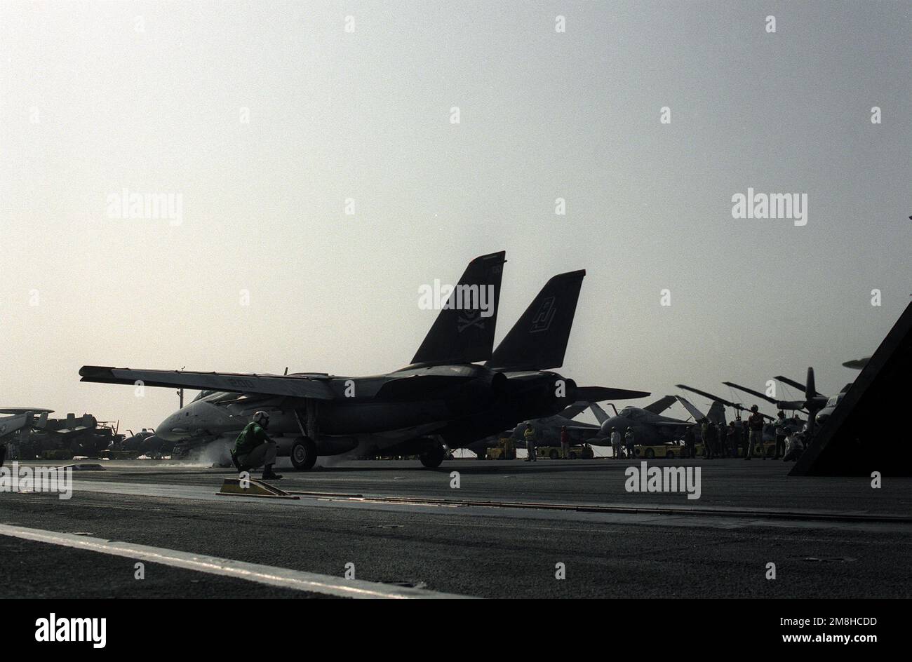 The catapult crew prepares to launch a Fighter Squadron 84 (VF-84) F ...
