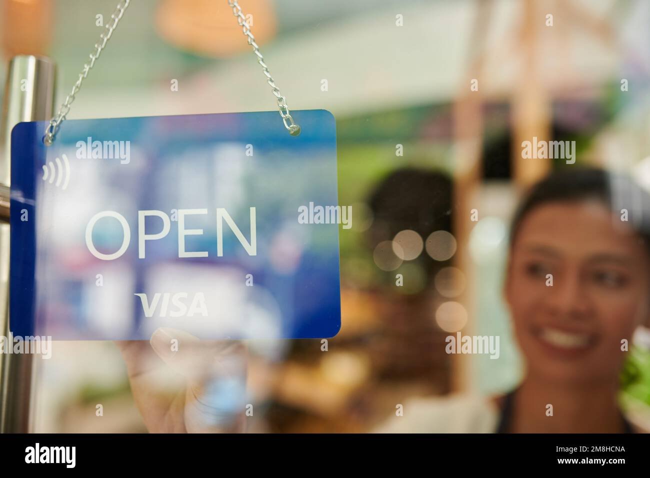 Smiling woman opening supermarket hi-res stock photography and images ...