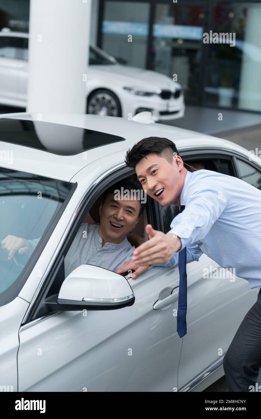 The old man test drive car Stock Photo - Alamy