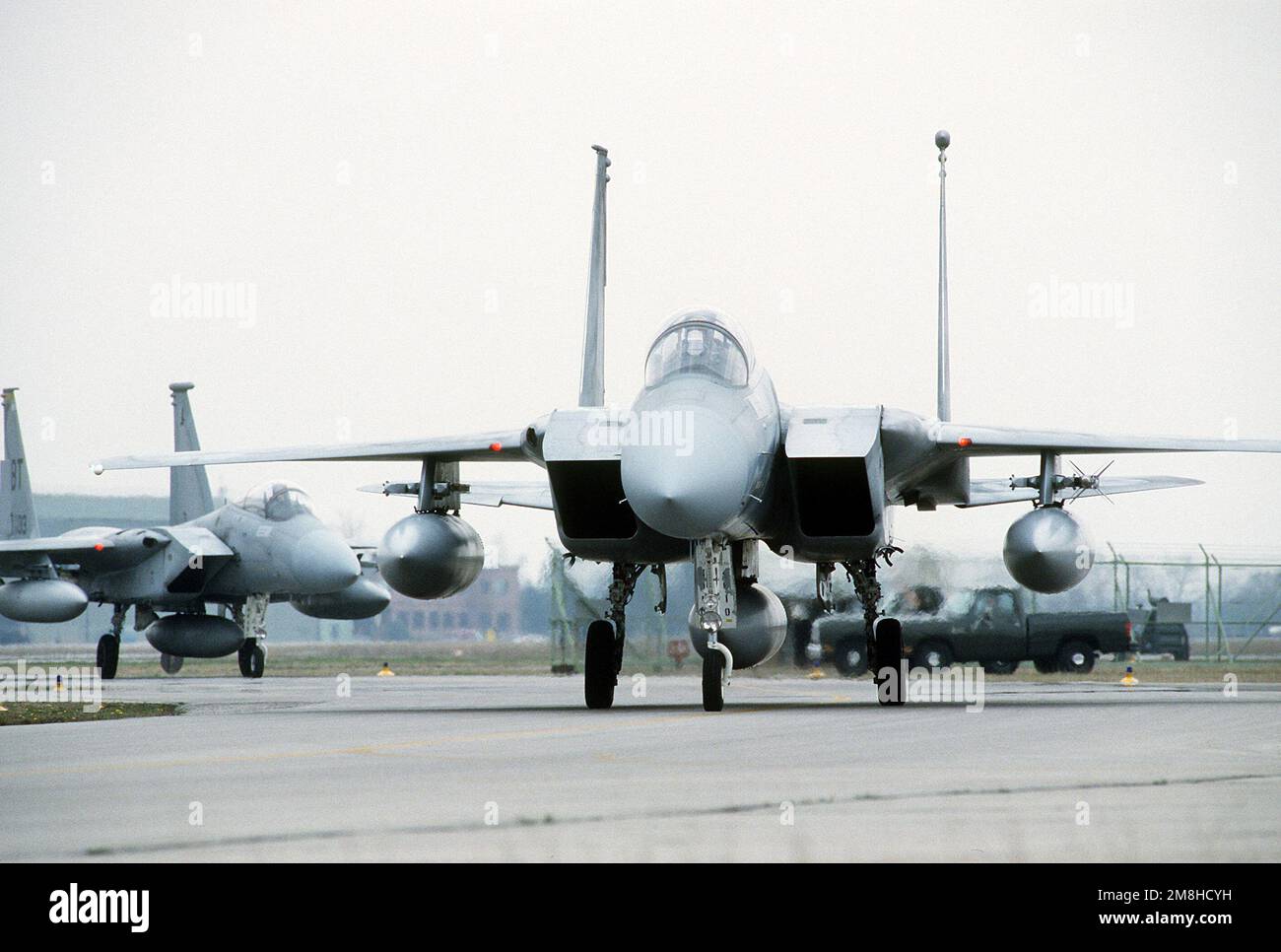 Two F-15C Eagle aircraft of the 53rd Fighter Squadron taxi on the ...