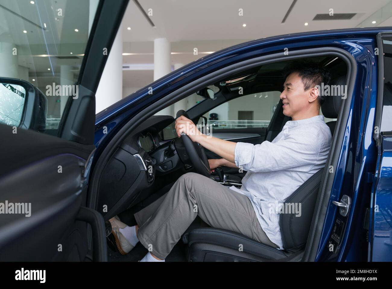 The old man test drive car Stock Photo - Alamy